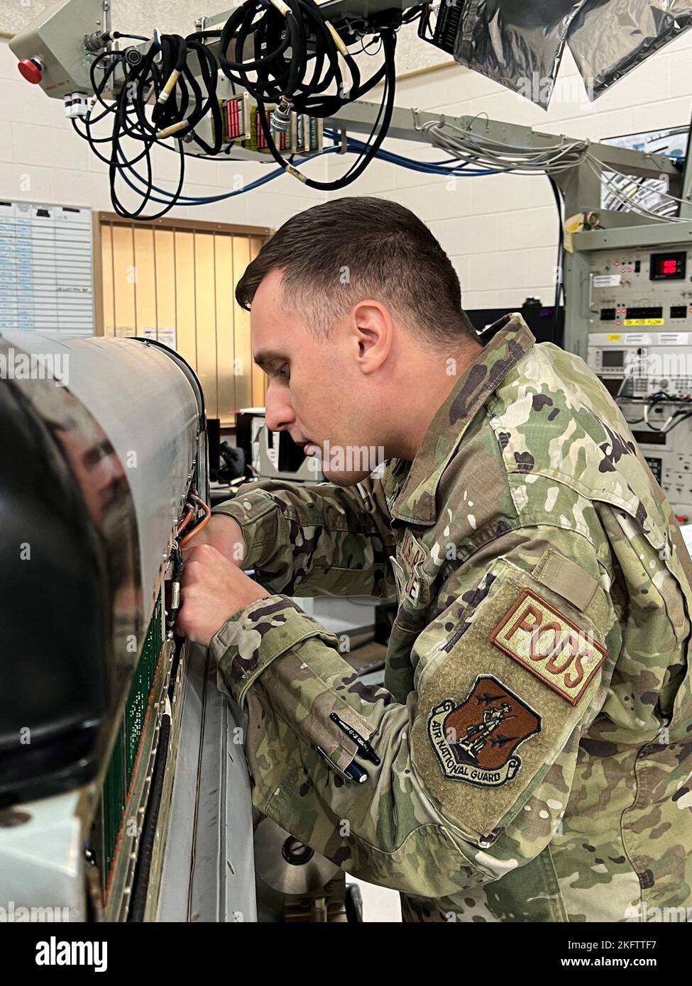 An Avionics Electronic Warfare Systems (POD) specialist assigned to the ...