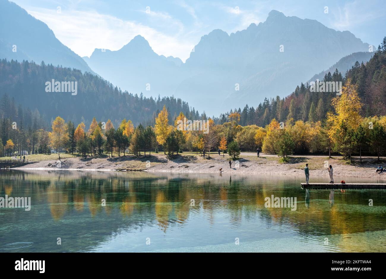 Scenic autumn forest at Crystal Lake in the Julian Alps, Slovenia Stock ...