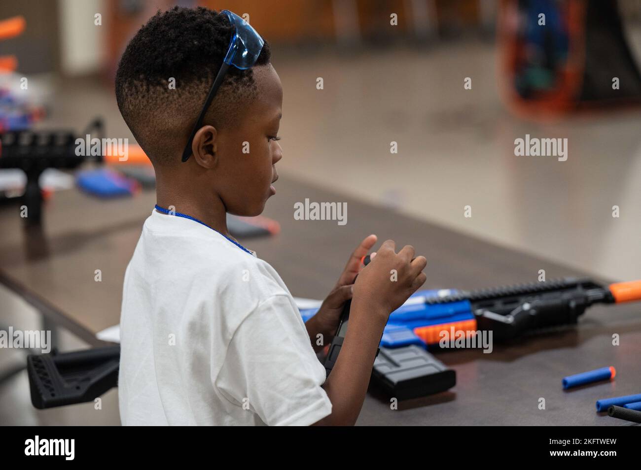 Military children participate in a simulated Combat Arms Training and ...
