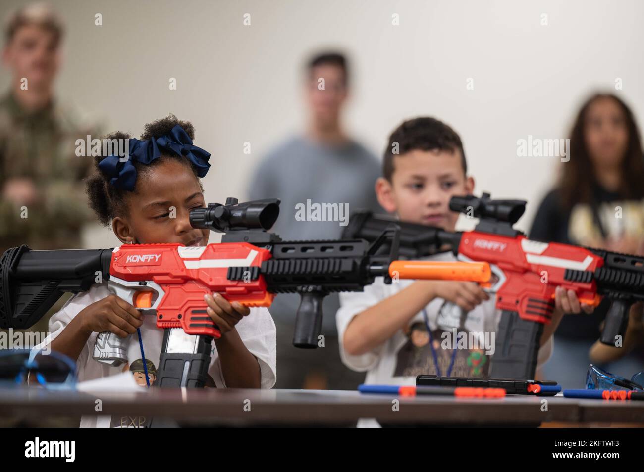 Military children participate in a simulated Combat Arms Training and ...