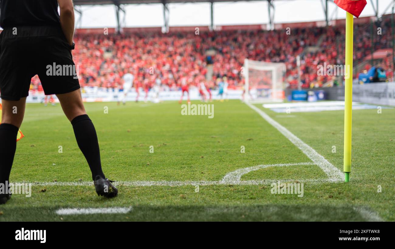 Touchline referee and flag in the corner of soccer pitch Stock Photo ...