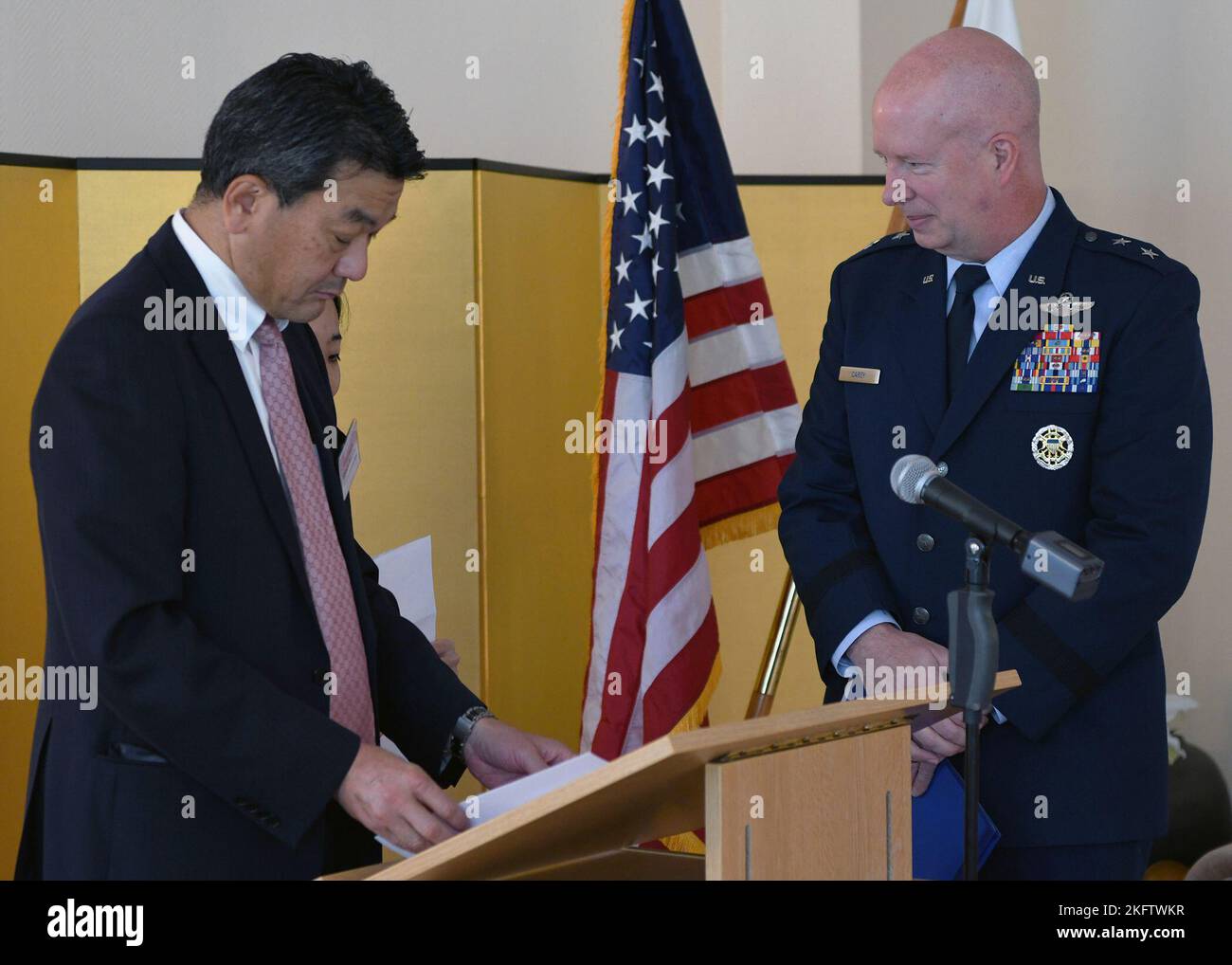 MG Carey stands with the Consulate General during the ceremony to ...