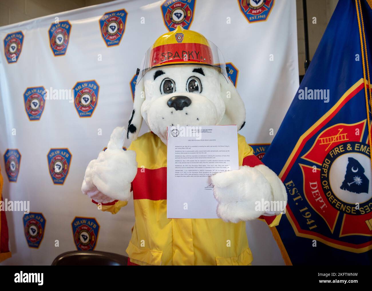 Sparky the Fire Dog poses for a portrait with the signed Fire ...
