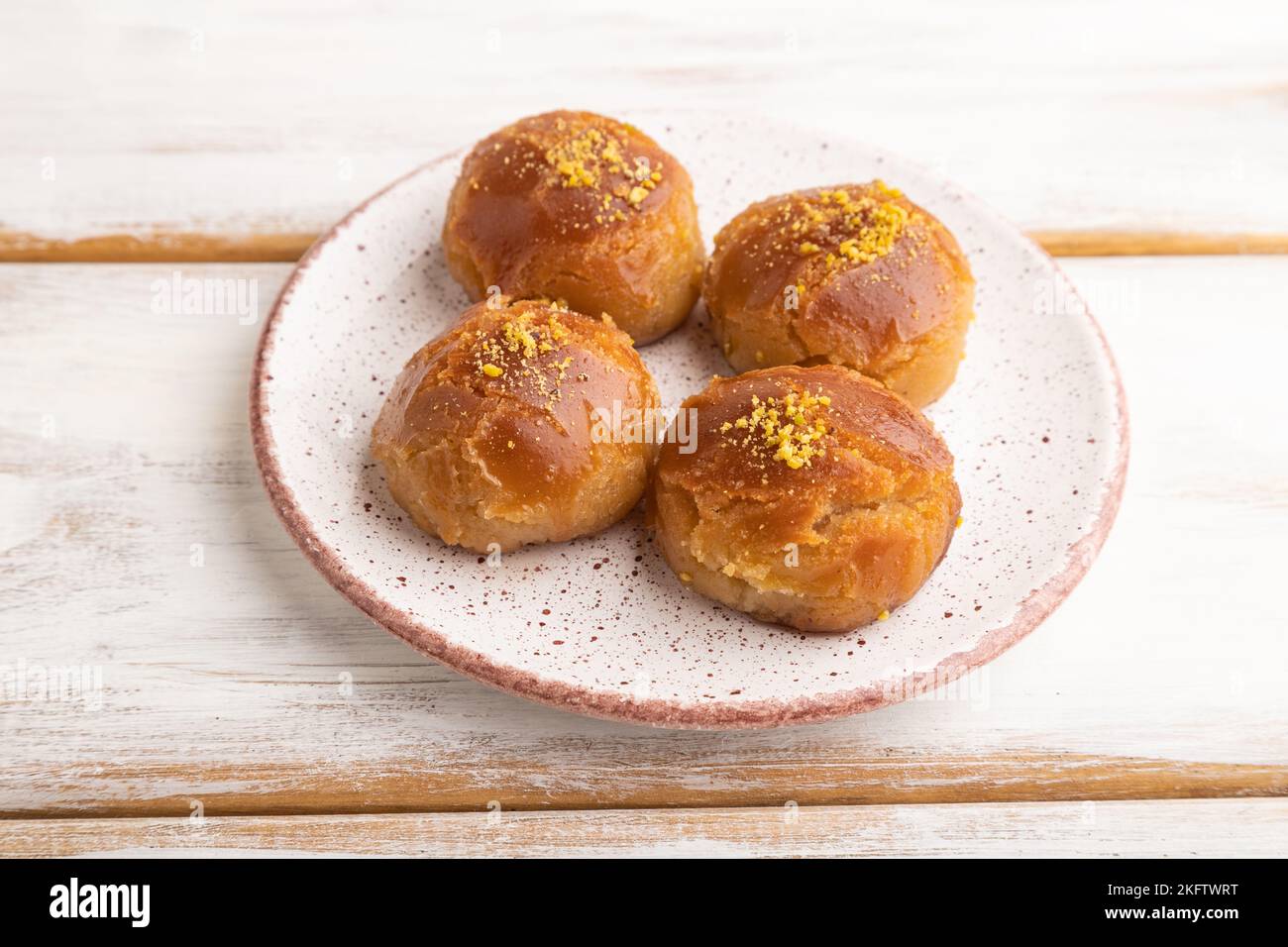 Homemade traditional turkish dessert sekerpare with almonds and honey ...