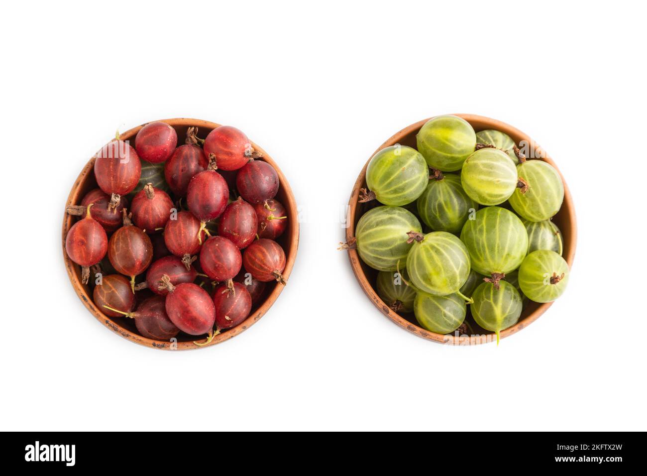 Fresh red and green gooseberry in clay bowl isolated on white ...