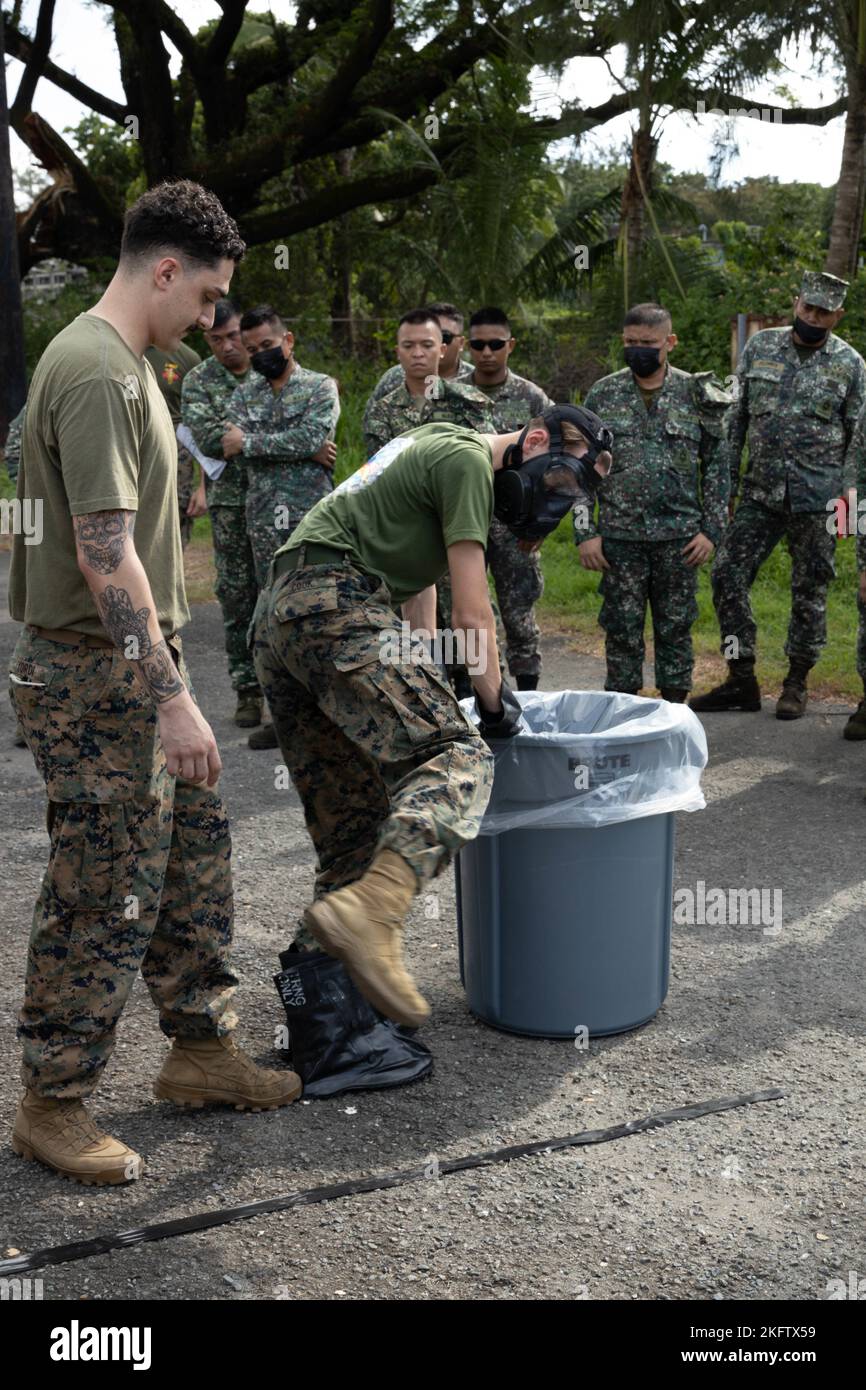U.S. Marines Corps Cpl. Anthony Yordi, left, helps Lance Cpl. Xander ...
