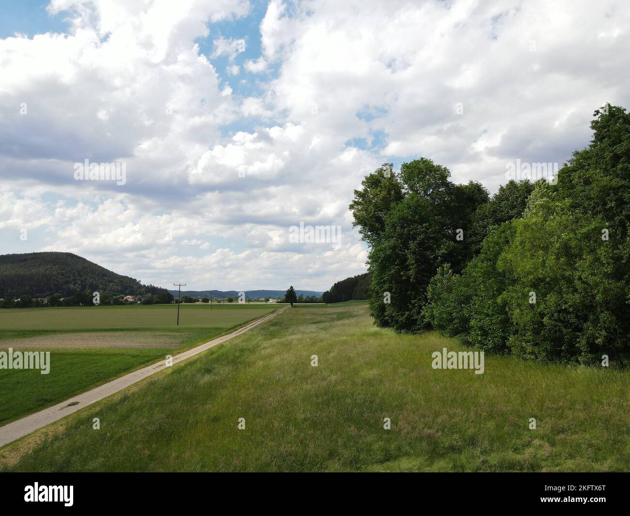A tranquil scenery of vast green meadows in the countryside Stock Photo ...