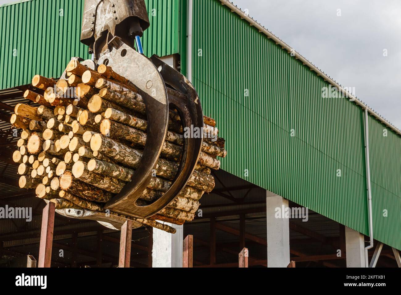 Industrial log loader at lambermill Stock Photo - Alamy