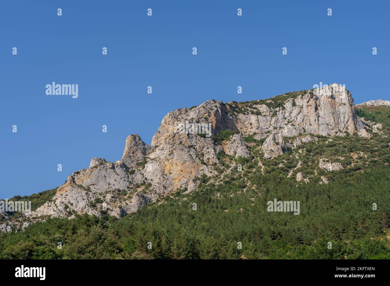 Scenic summer mountain landscape panorama of rocky outcrop emerging ...