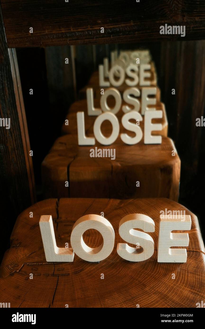 A vertical shot of the word lose reflecting the word lose Stock Photo ...