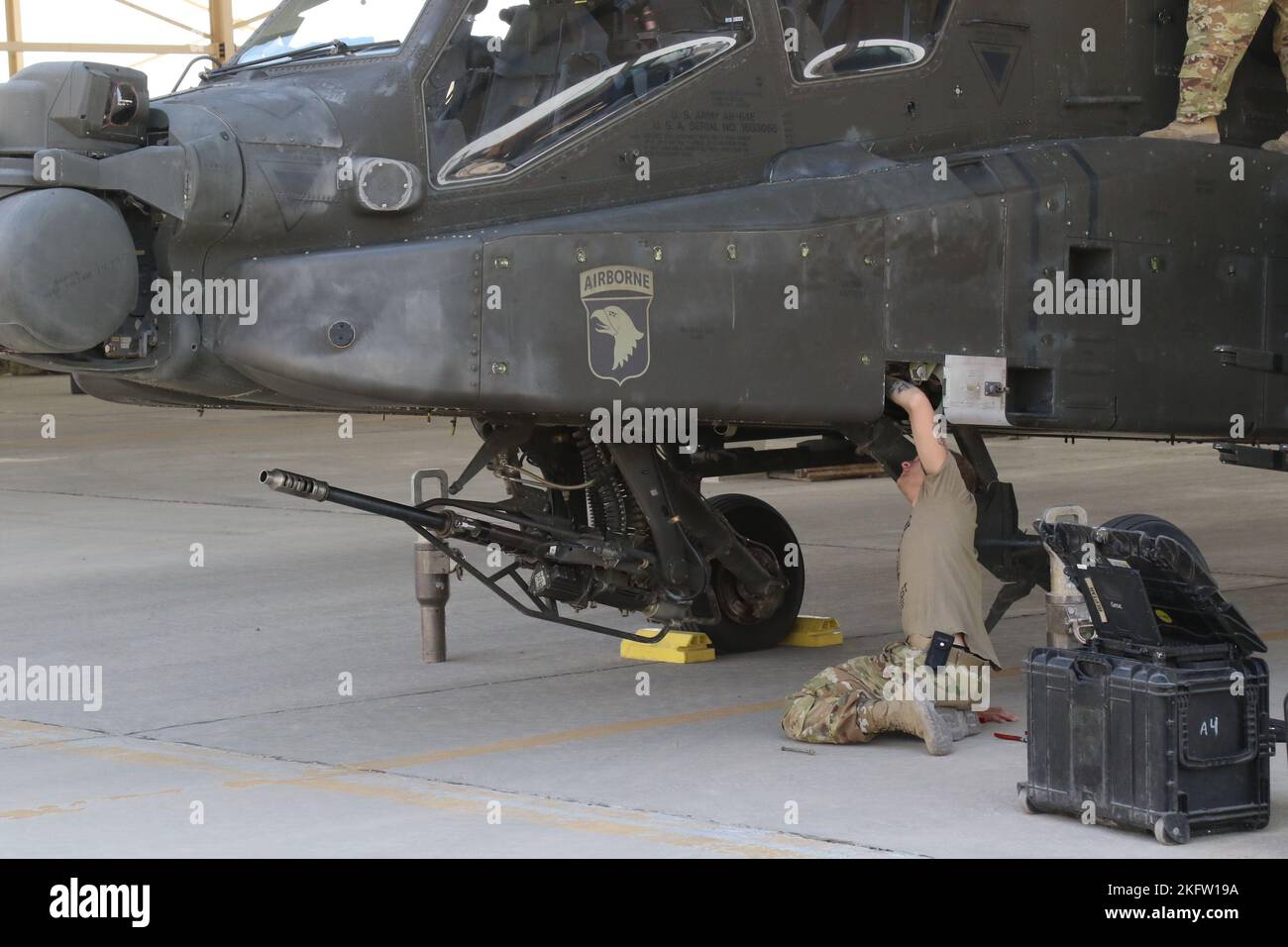 A Soldier of the 101st Combat Aviation Brigade prepares his AH-64 ...