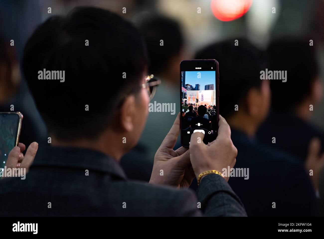An attendee records a performance by singer So Chan-whee during the ...