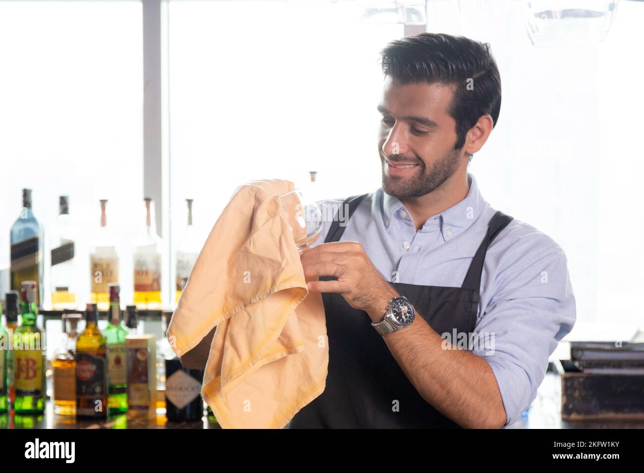 Waiter cleaning the glass hi-res stock photography and images - Alamy