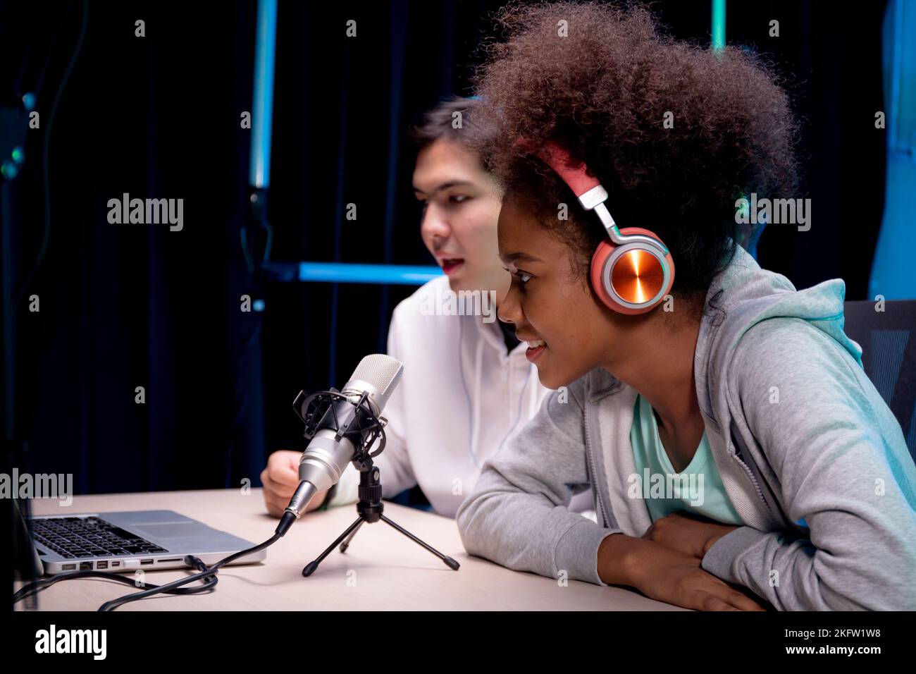 Young African American woman and asian man a podcast interview and ...