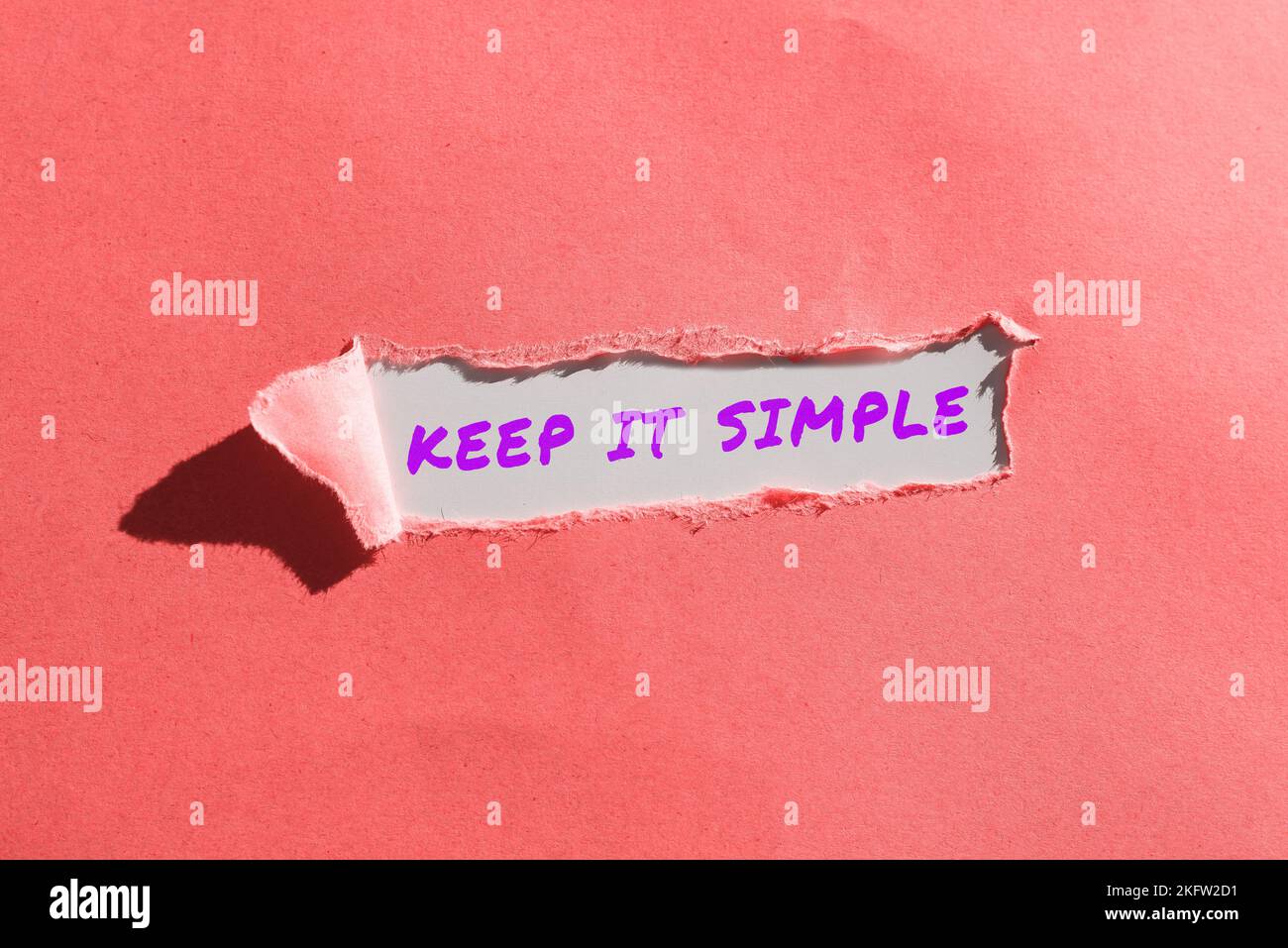 Hand writing sign Keep It Simple. Word for Easy to toss around ...