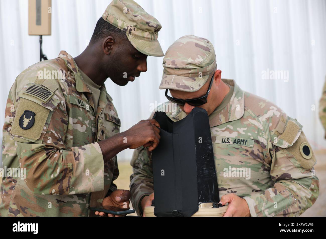 U.S. Army Spc. Lalisa Ali, left, assigned to Troop B, 2nd Squadron ...