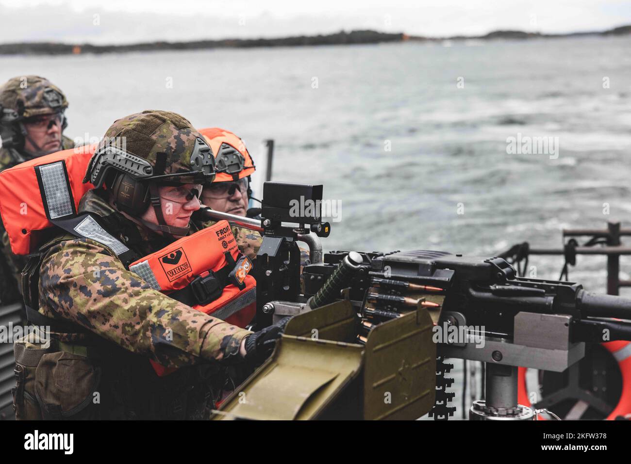 A Finnish soldier with Vaasa Coastal Battalion, fires a 12.7 NSV ...