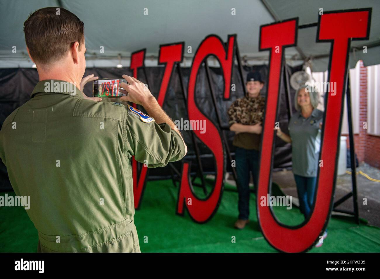 U.S. Air Force Col. Russell P. Cook, 23rd Wing commander, takes a photo ...