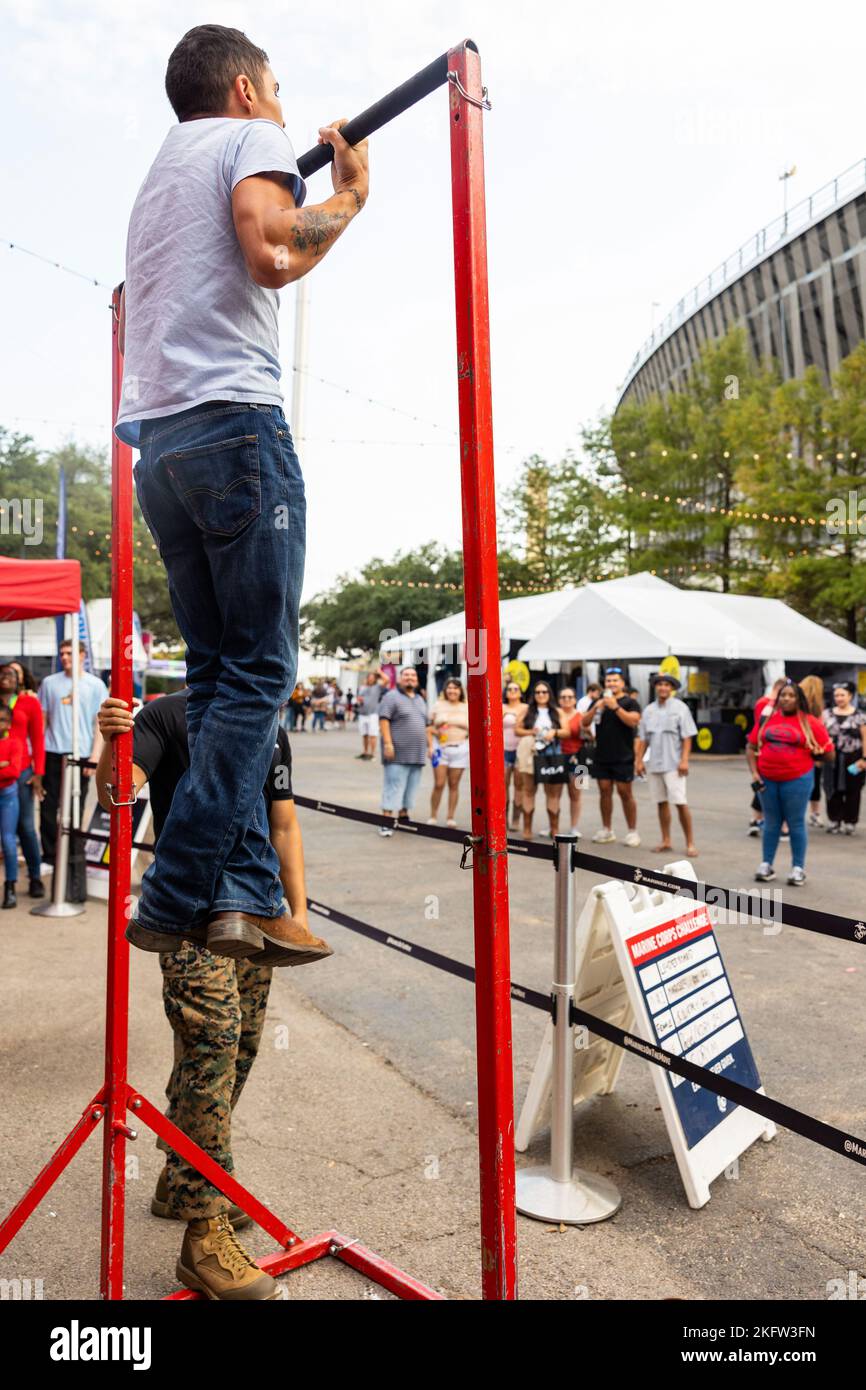 An individual actively gets his chin above the bar while participating ...