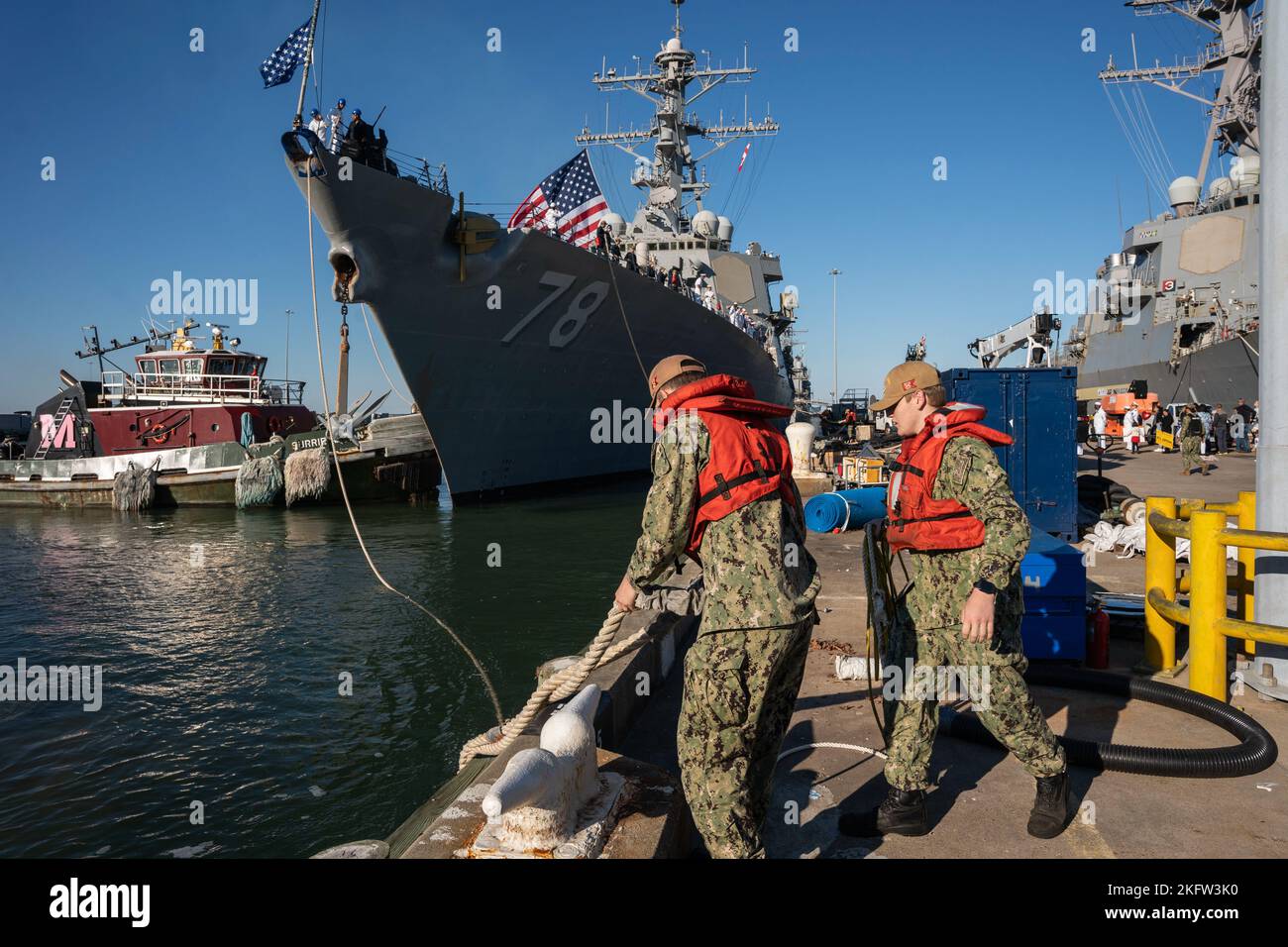 NORFOLK, Va. (Oct. 9, 2022) – Line-handlers secure a mooring-line to ...