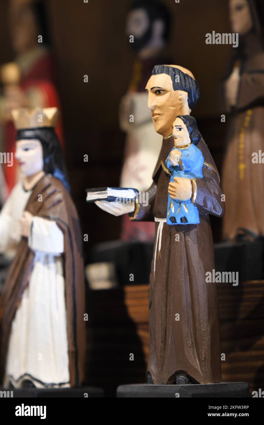 A vertical shot of Christian statues, a siant holding baby Stock Photo ...