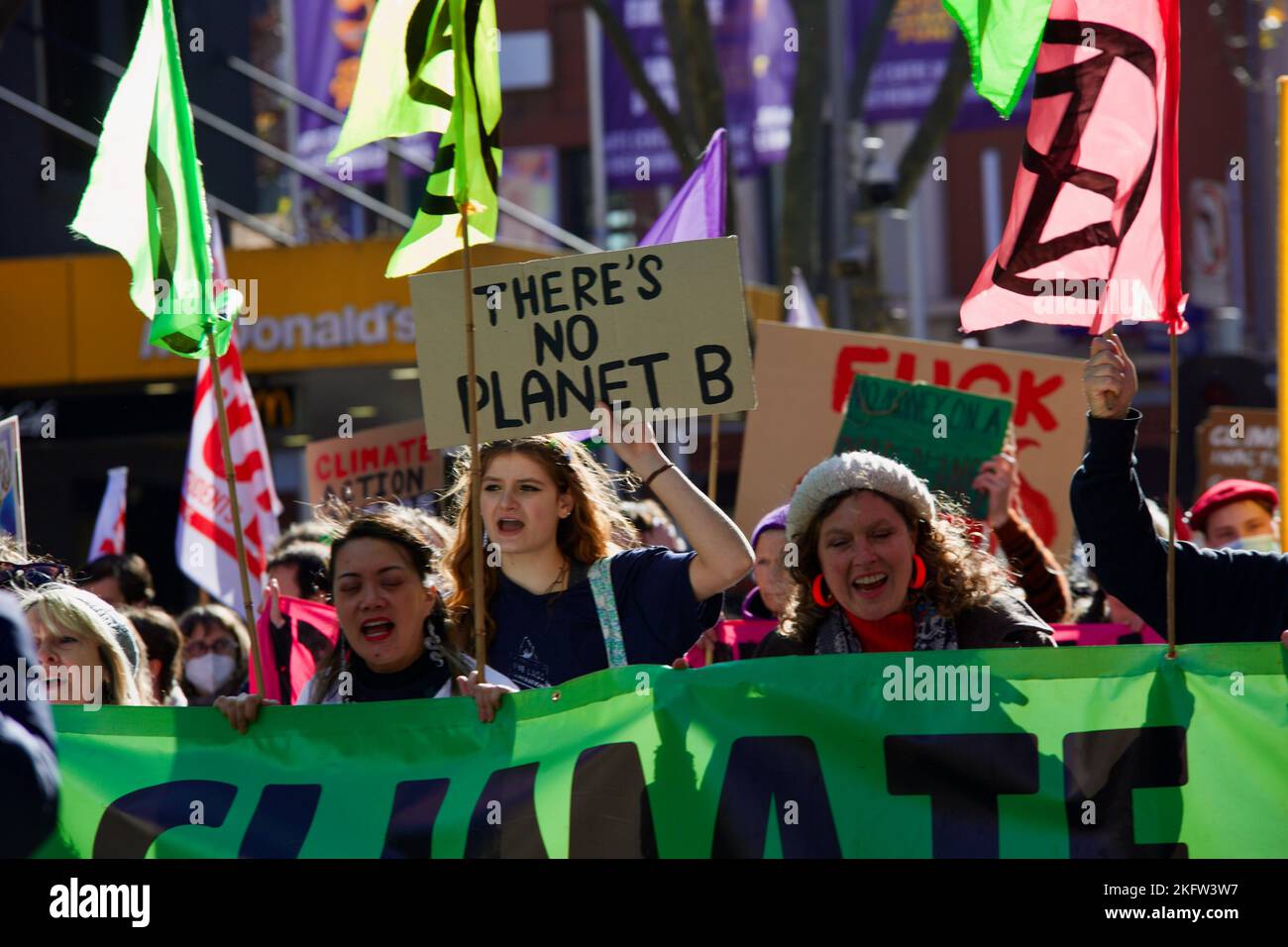 A crowd of people with signs protesting at a Climate Change ...