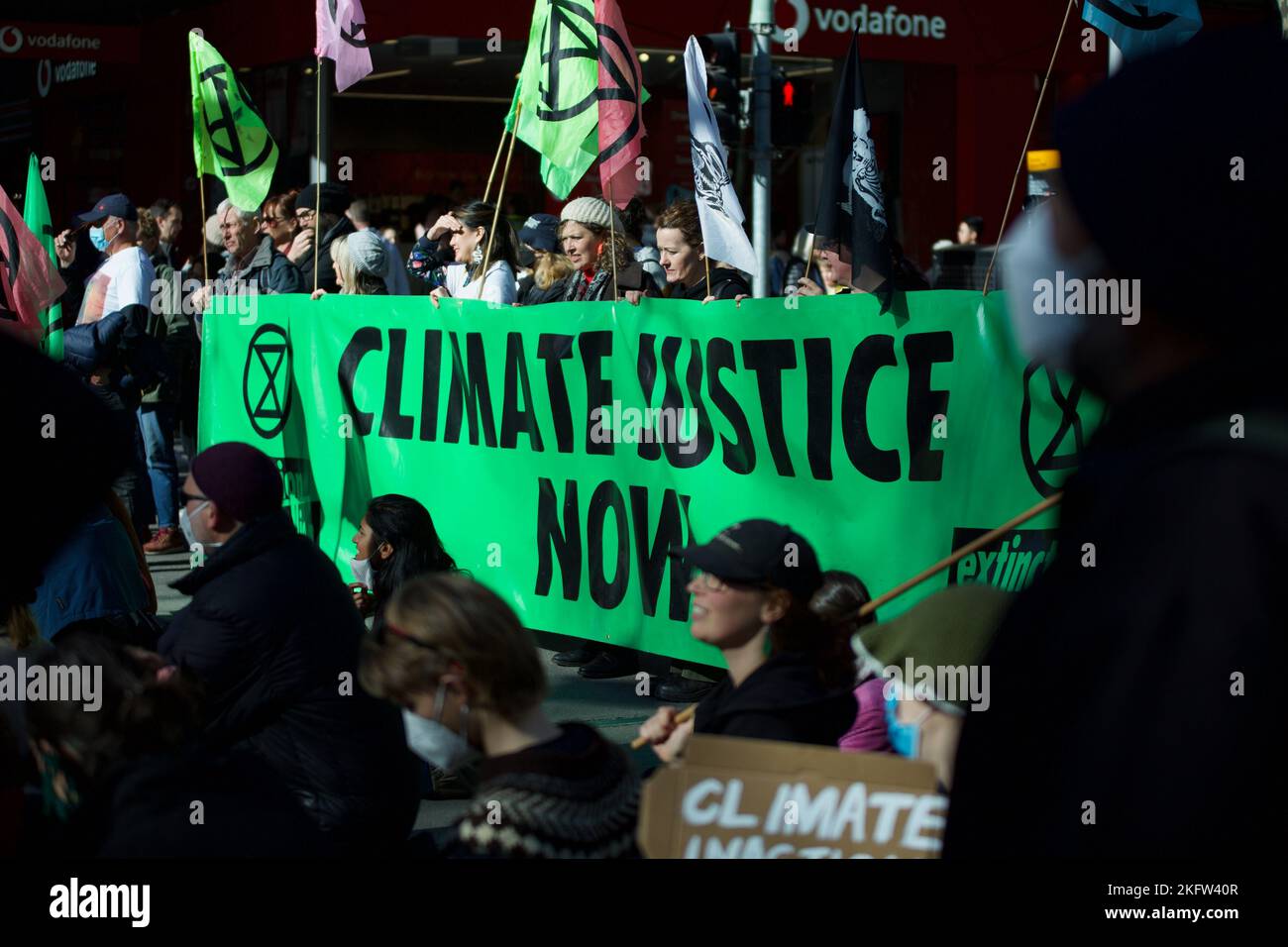 A crowd of people with signs protesting at a Climate Change ...