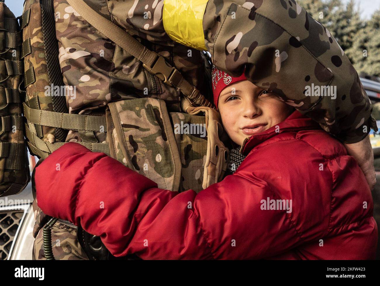 Kherson, Ukraine, Ukraine. 19th Nov, 2022. Sofiyka, 7, hugs soldiers at ...