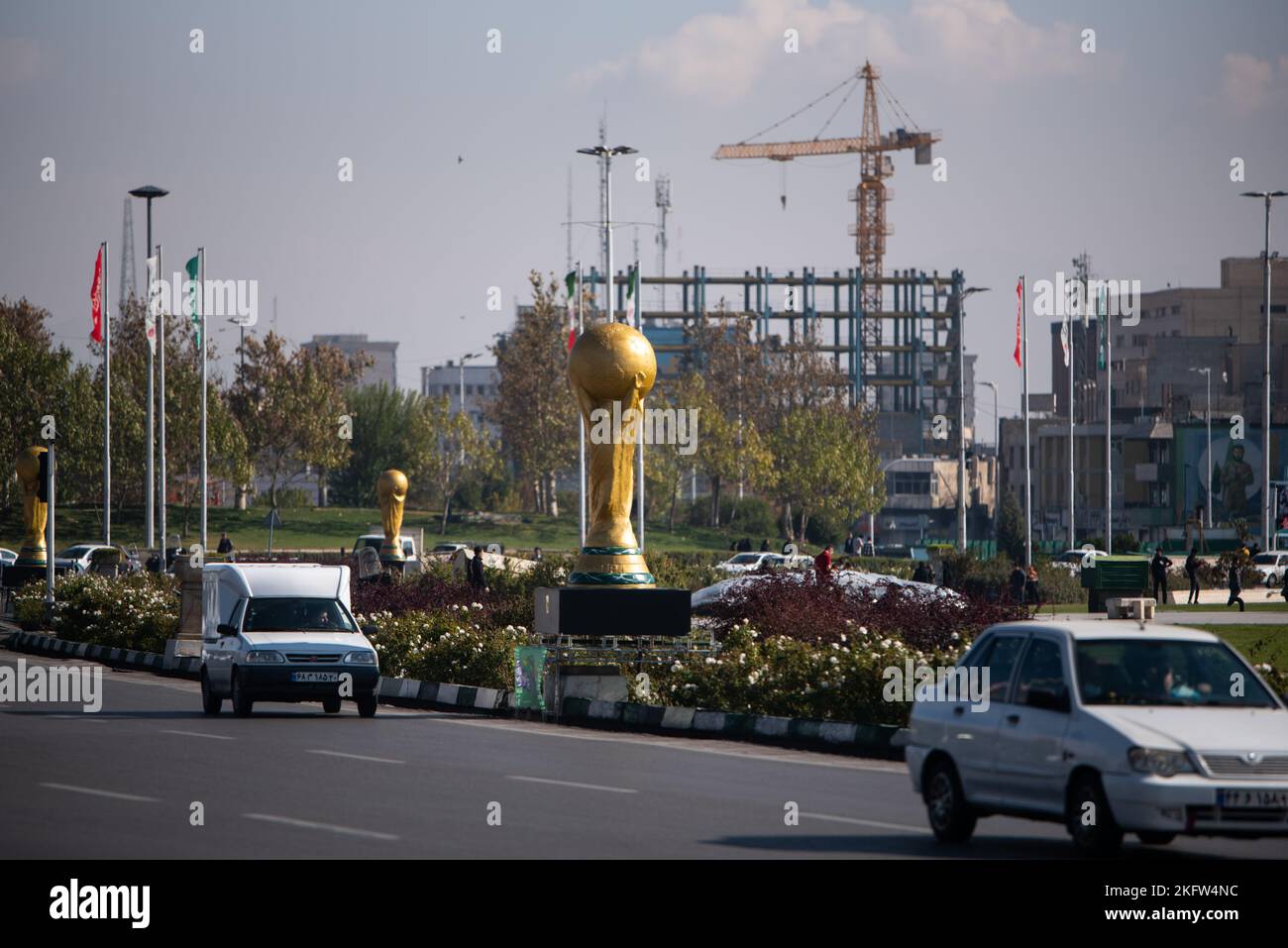 Tehran, Iran. 18th Nov, 2022. Vehicles drive past a sculpture of the ...