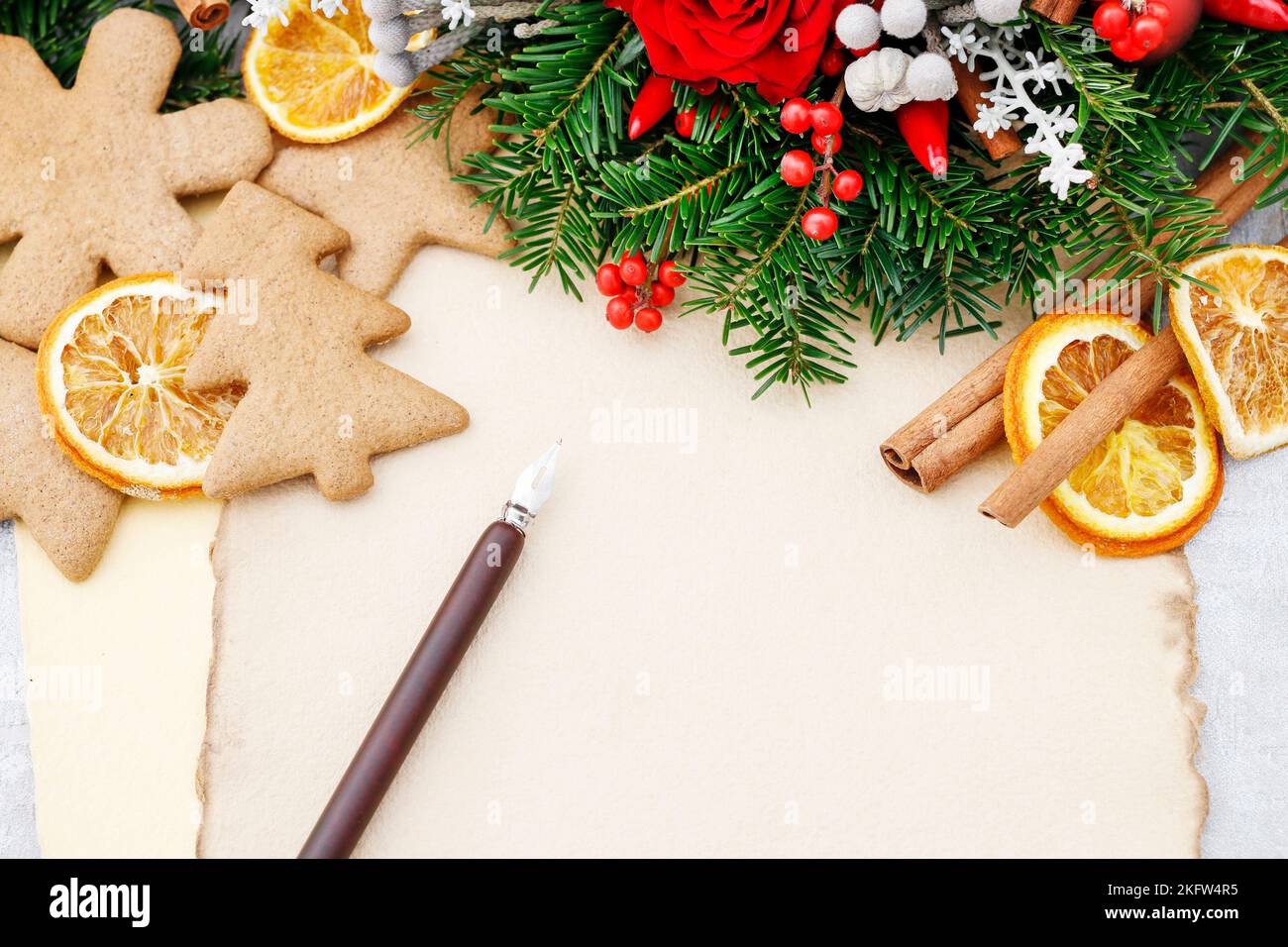 Christmas background with gingerbread cookies, fir wreath, dried fruits ...