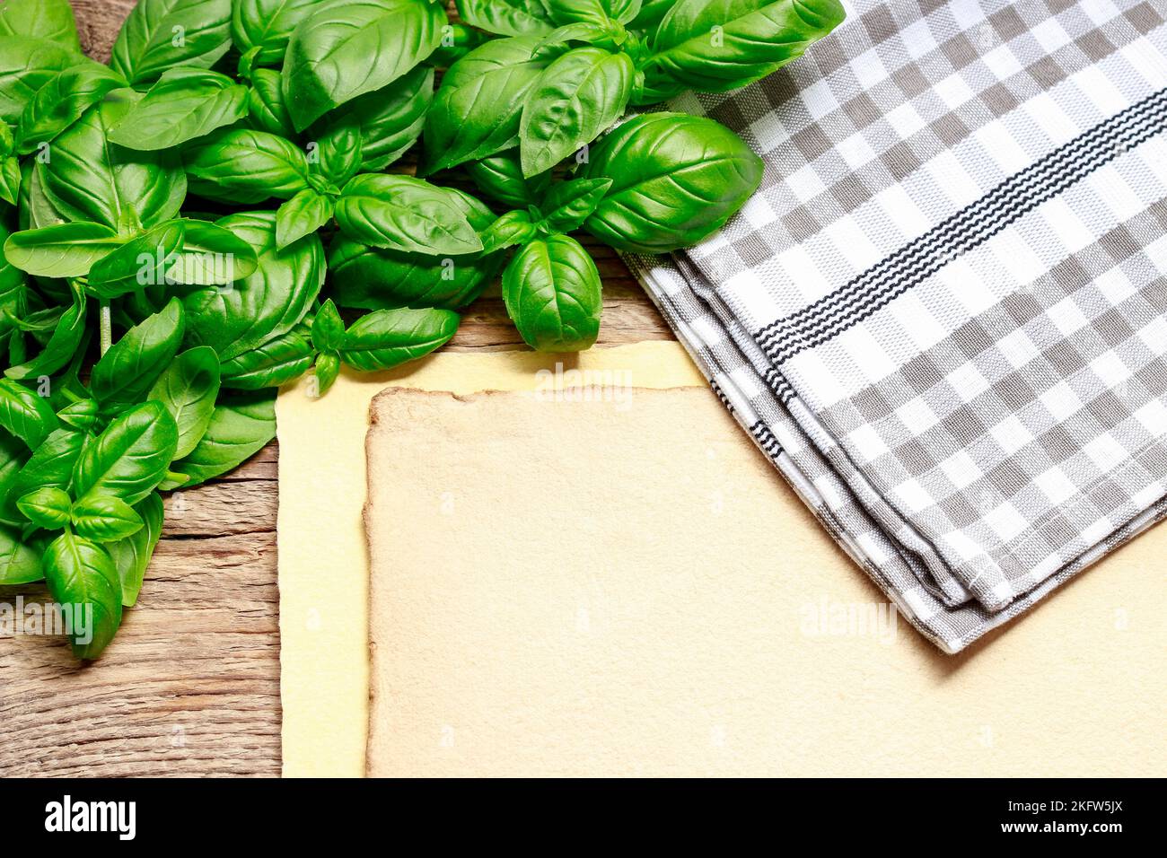 Basil leaves on wooden background. Copy space Stock Photo - Alamy