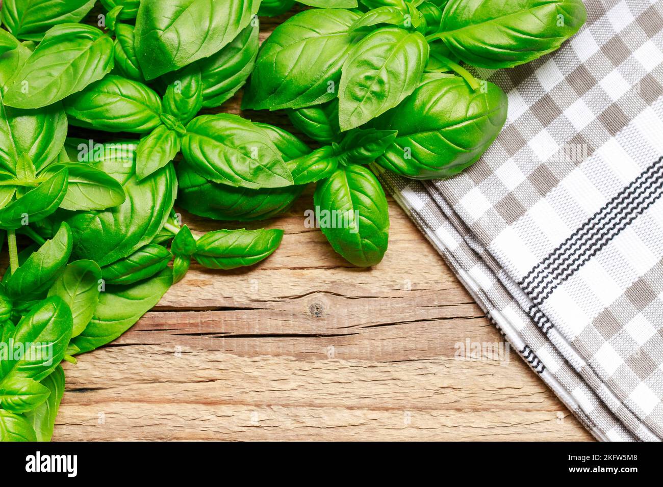 Basil leaves on wooden background. Copy space Stock Photo - Alamy