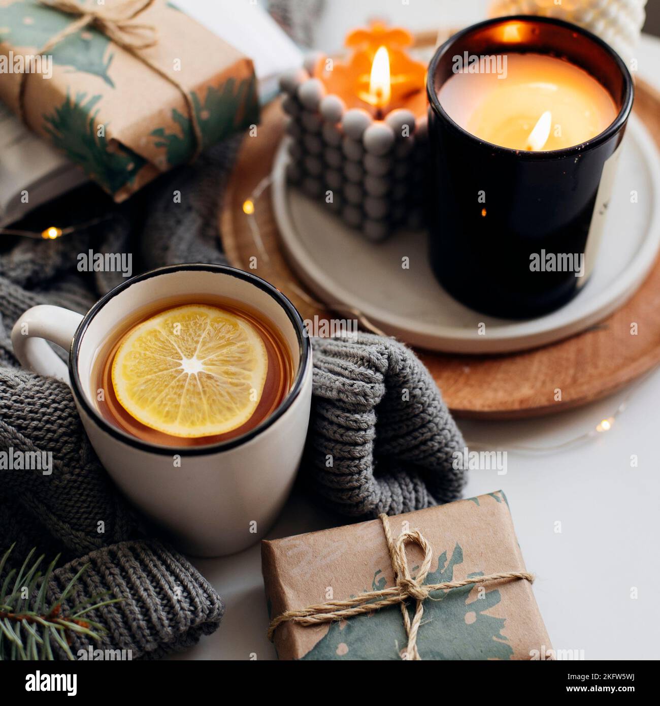 Winter home cozy concept. Hot tea with lemon, open book, warm sweater ...