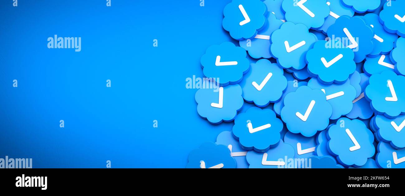 Blue check mark logos on a heap on a table. Copy space. Verification ...