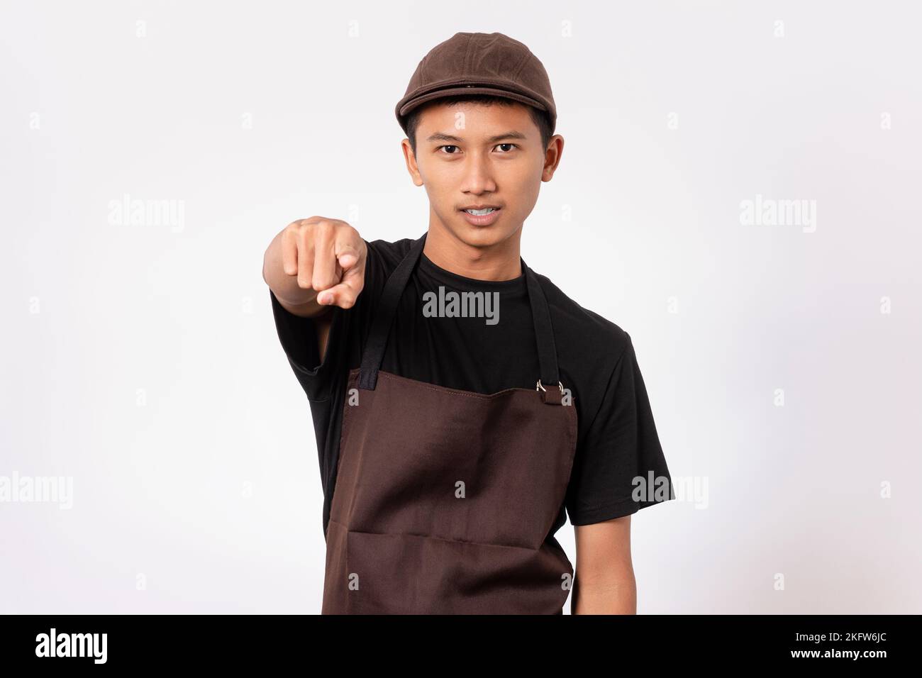 Handsome barista asian man wearing brown apron and black t-shirt ...
