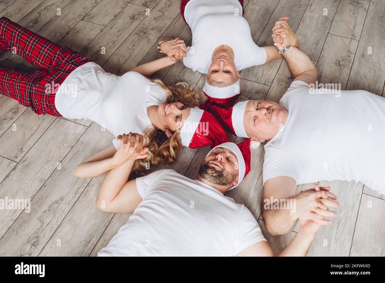Old parents lies on the floor with their children Stock Photo - Alamy