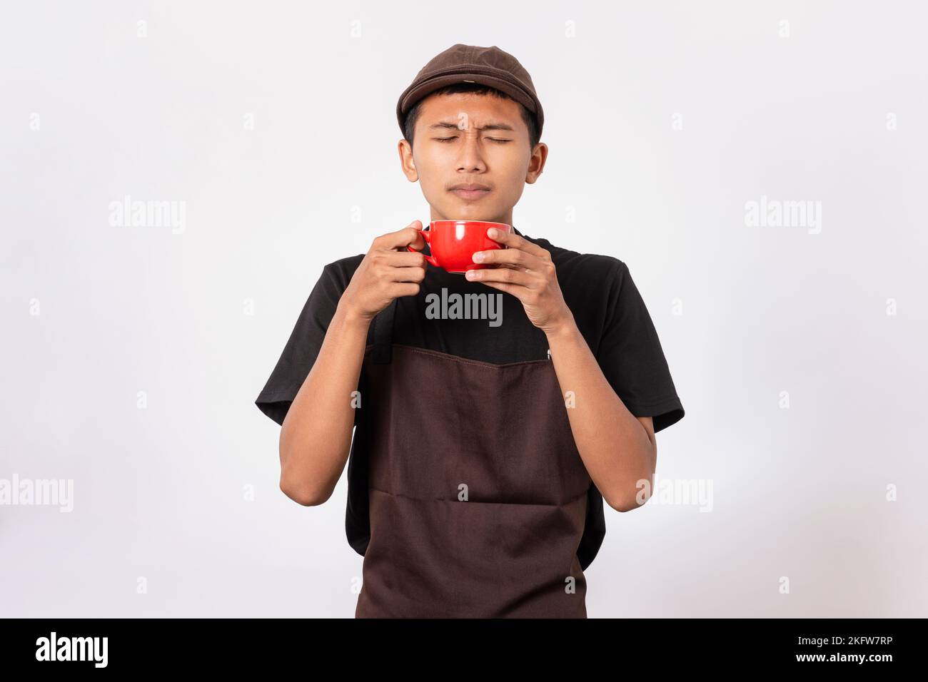 Handsome barista asian man wearing brown apron and black t-shirt ...