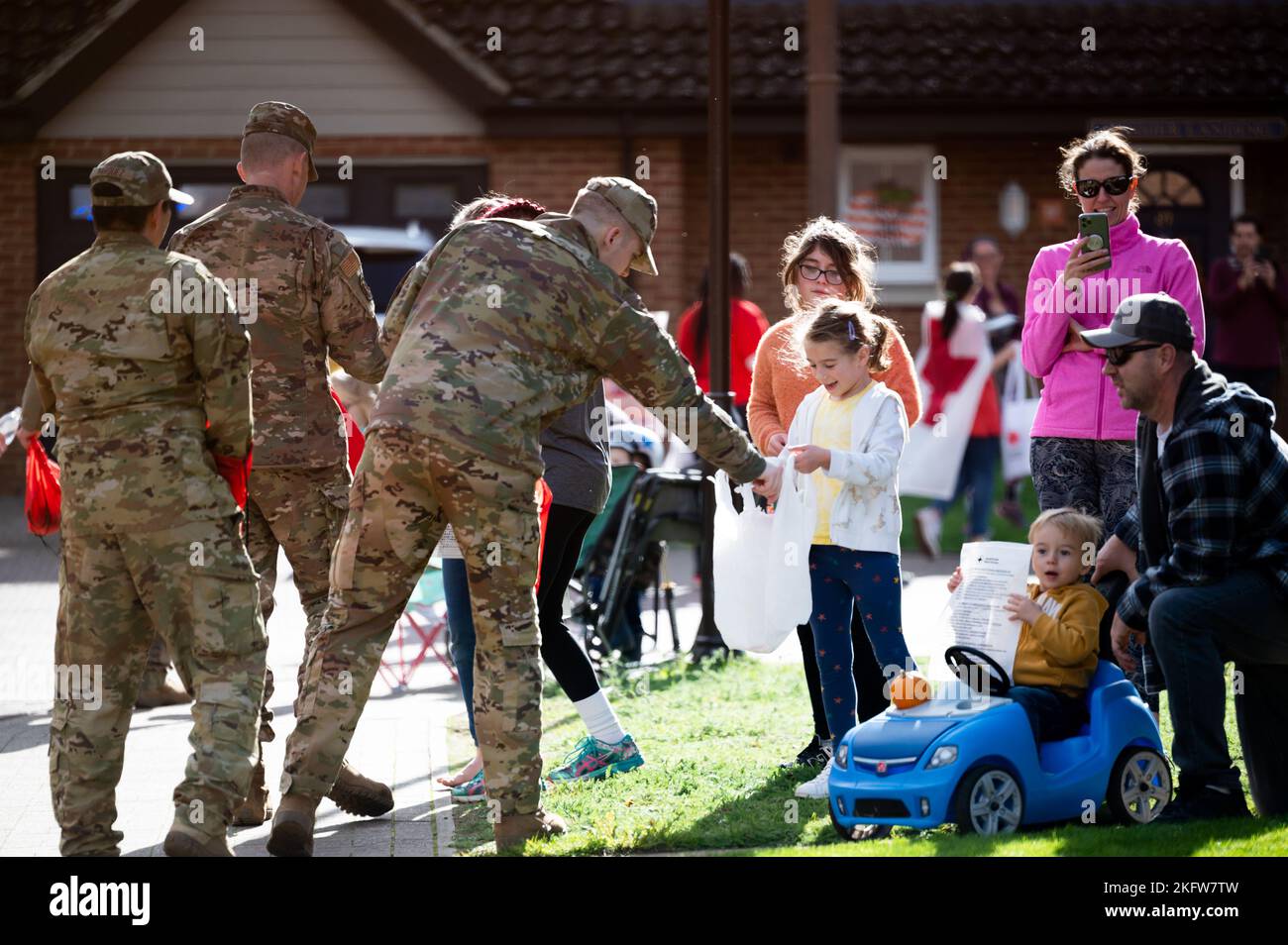 Airmen with the RAF Lakenheath Fire Department hand out candy during ...