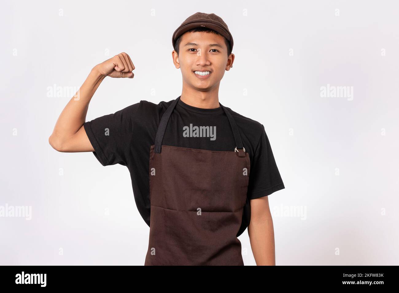 Handsome barista asian man wearing brown apron and black t-shirt ...