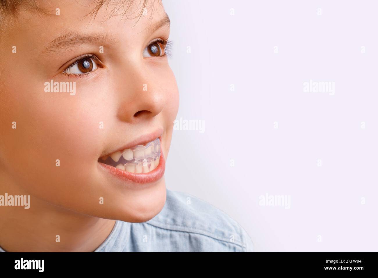 Boy is wearing orthodontic silicone trainer or night-guard case Stock ...