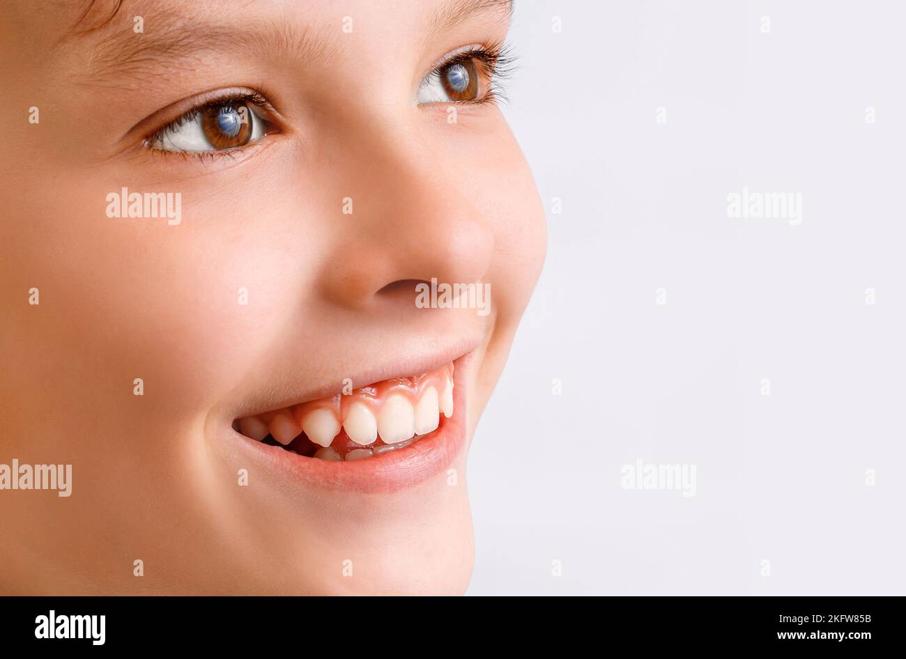 Close up portrait of a happy boy smiling on white background Stock ...