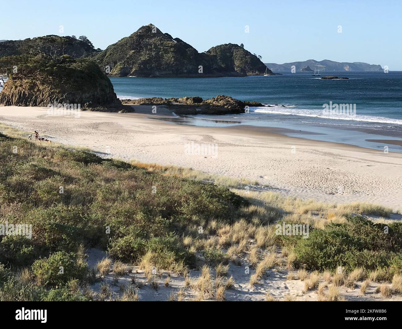 A beach with sand piles and waves approaching in the background Stock ...