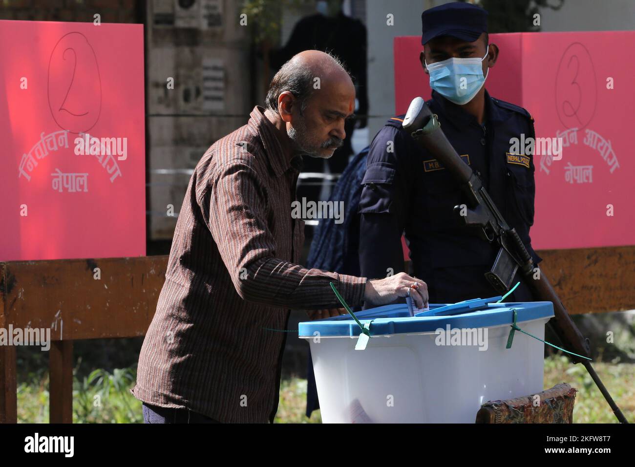 On November.20,2022 in Kathmandu, Nepal. A man castes his vote at the ...