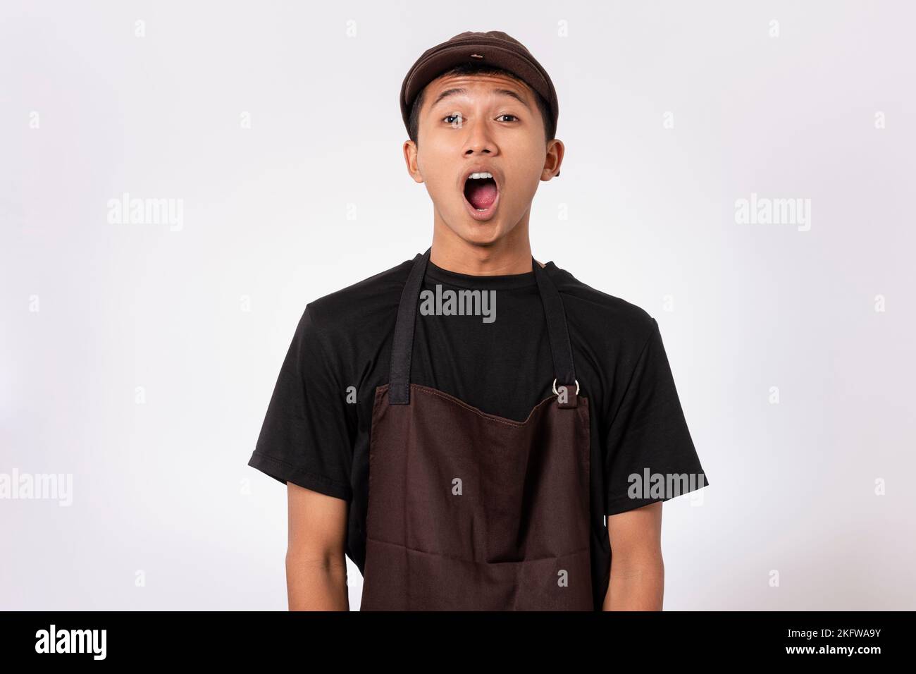 Handsome barista asian man wearing brown apron and black t-shirt ...