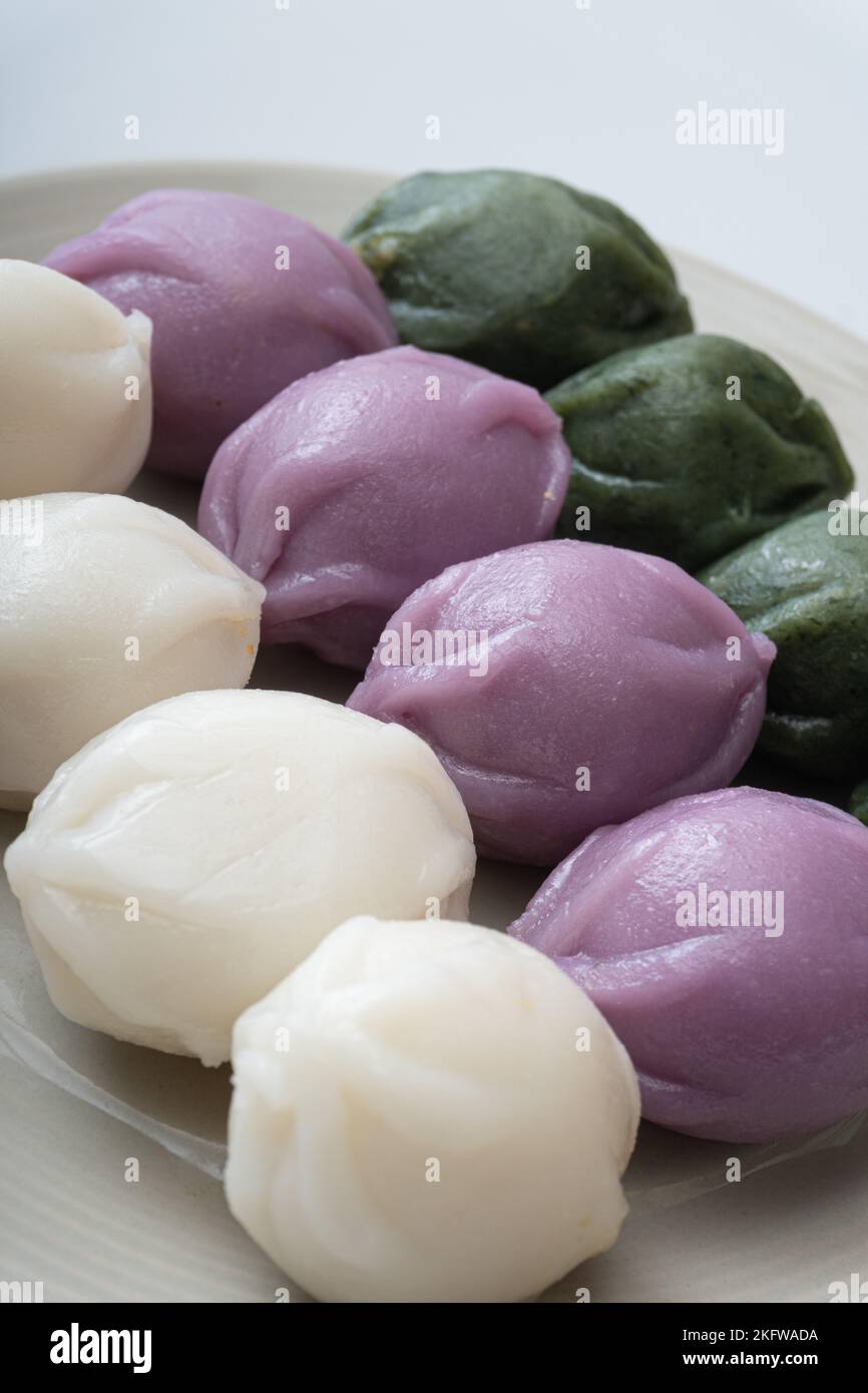 Delicious-looking three-color honey rice cakes served in a bowl Stock ...