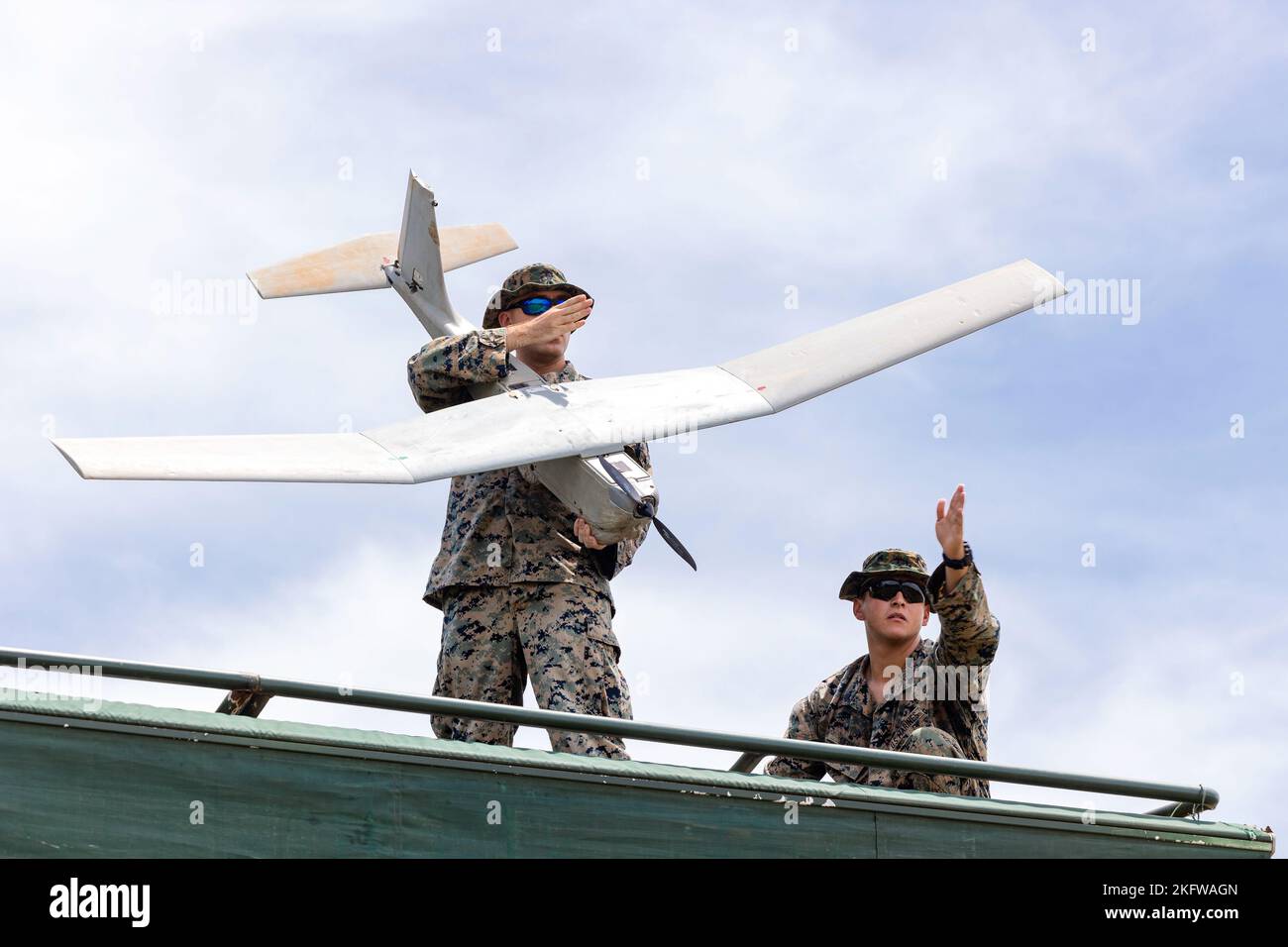 U.S. Marine Corps Sgt. Gabriel Young, left, surveillance sensor ...