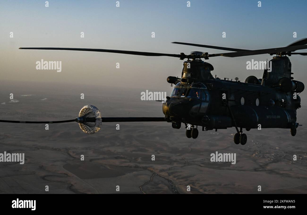 A U.S. Army MH-47G Chinook receives fuel from a U.S. Air Force HC-130J ...