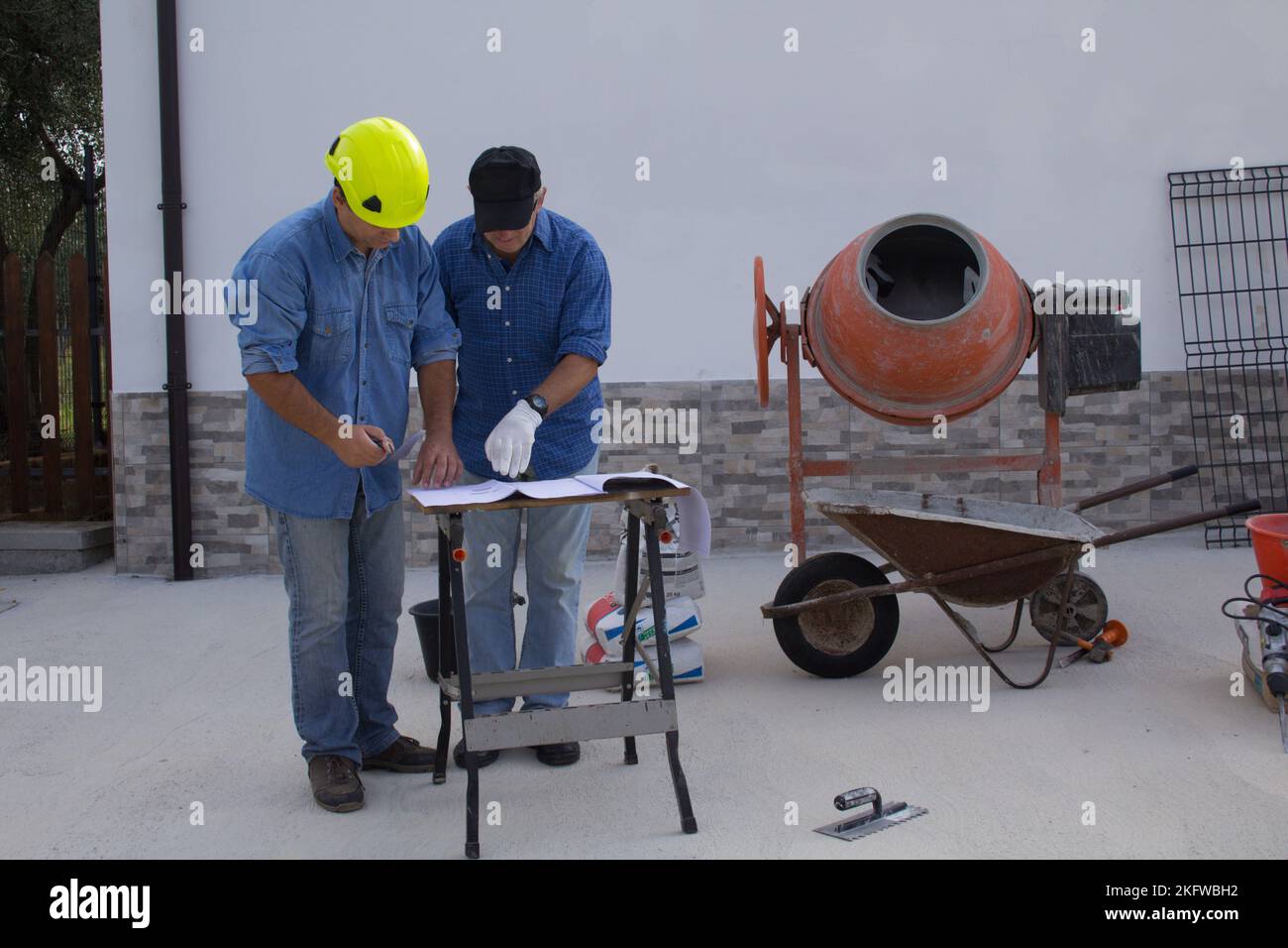 Image of an engineer and construction worker on a construction site as ...