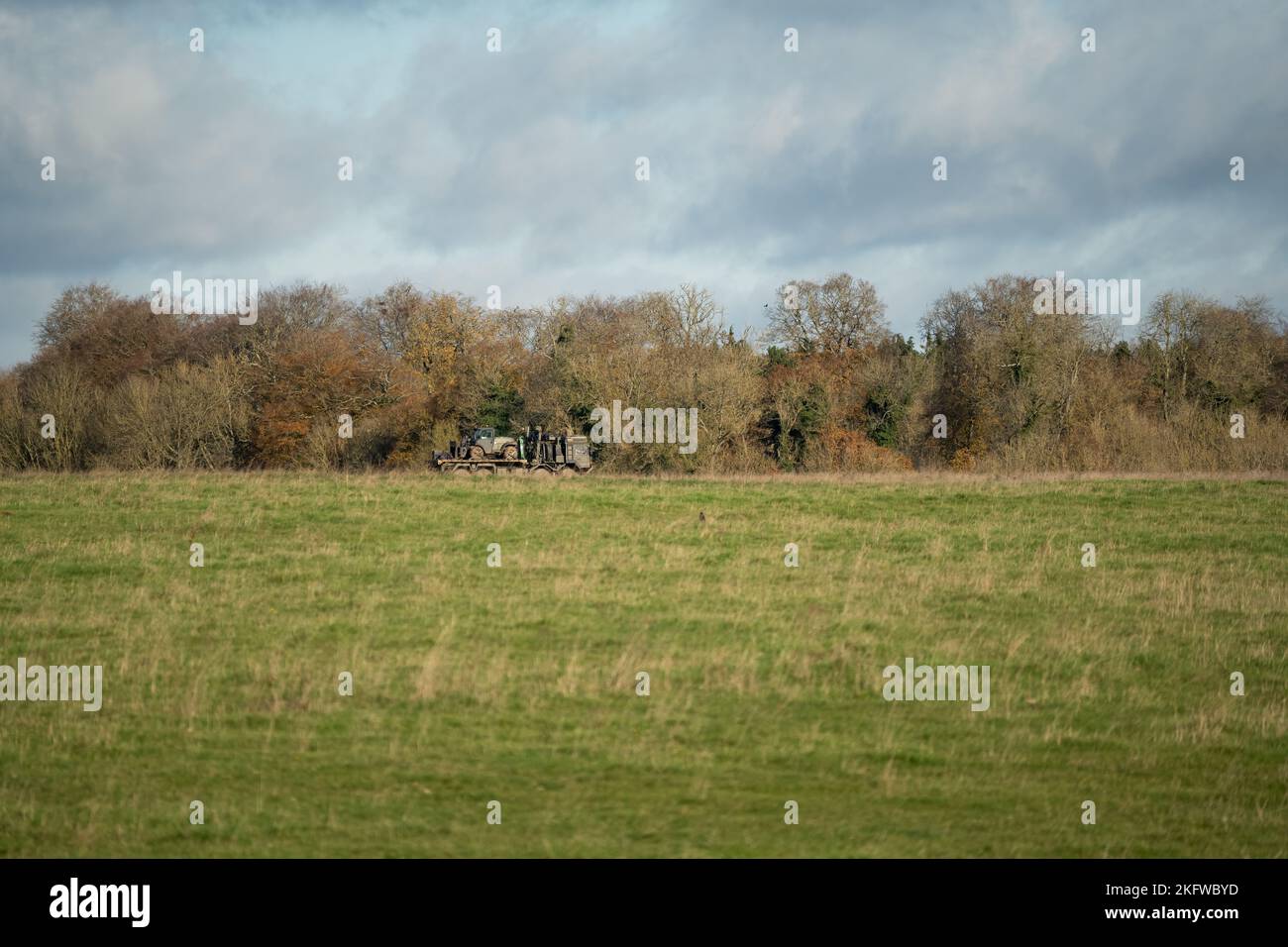 British army MAN HX77 8x8 logistics truck with armed rooftop soldier in ...
