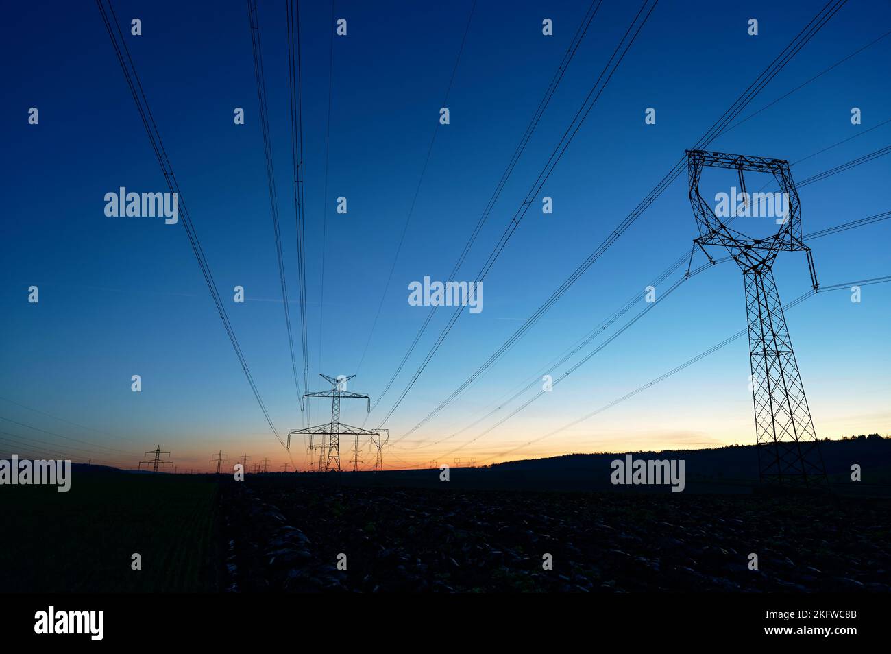 High voltage pylons. Rising energy prices - a concept for industry and ...
